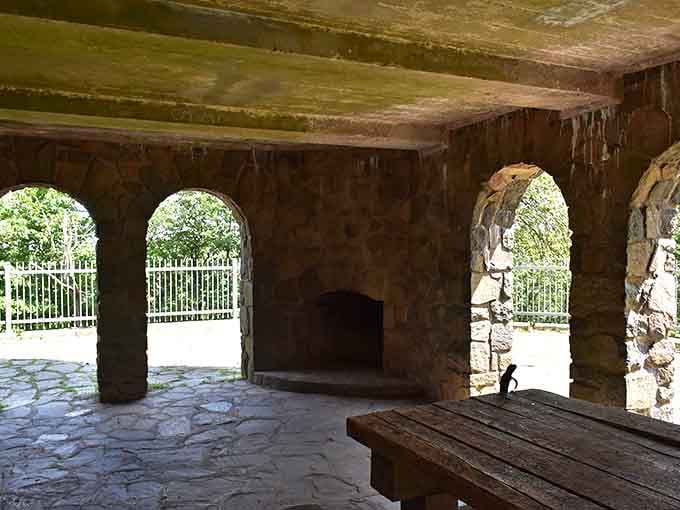 Ancient arches frame modern views, where weathered stone meets endless sky in a photographer's dream come true.