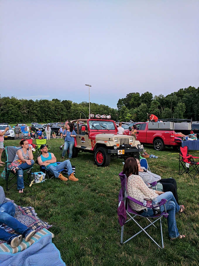 Families spread blankets and set up chairs around that vintage Jeep, creating their own tailgate party with a view.
