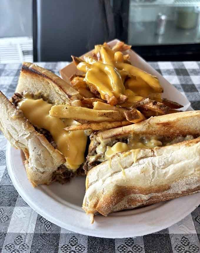 Cheese fries and a loaded cheesesteak together on one plate is what peak performance looks like, friends.