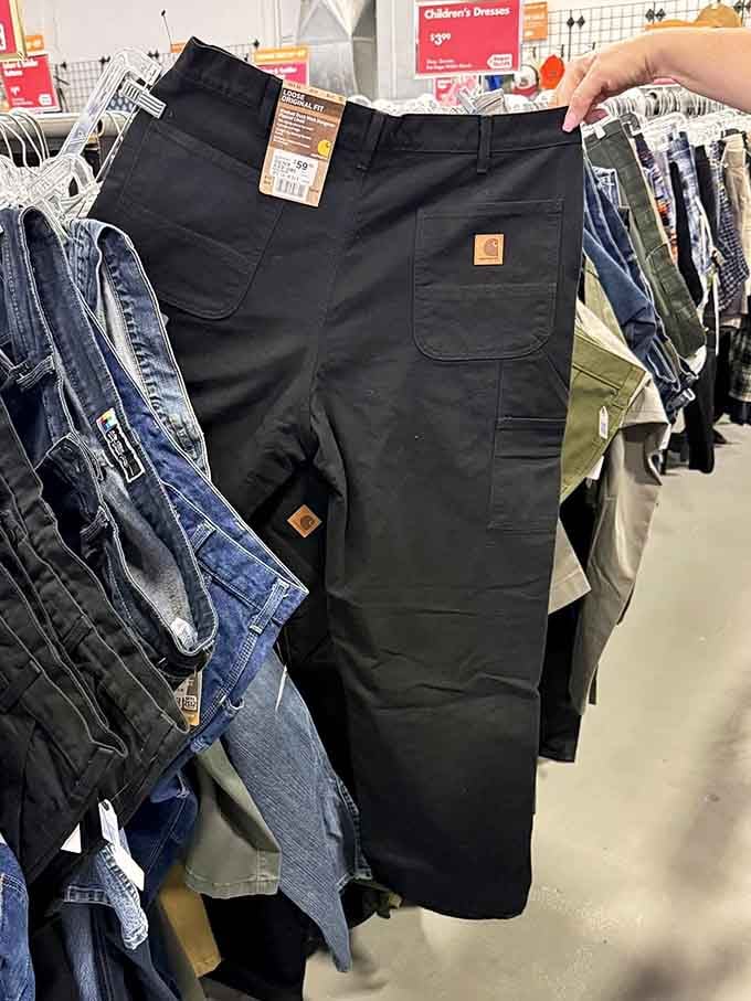 Brand new work pants with tags still attached, proving thrift stores aren't just about worn-in vintage finds.