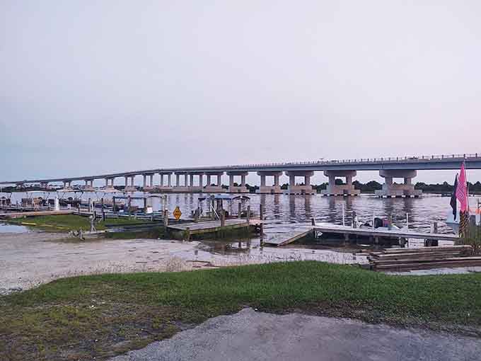 The Intracoastal Waterway at dusk, where boats rest and the bridge reminds you you're definitely on island time.