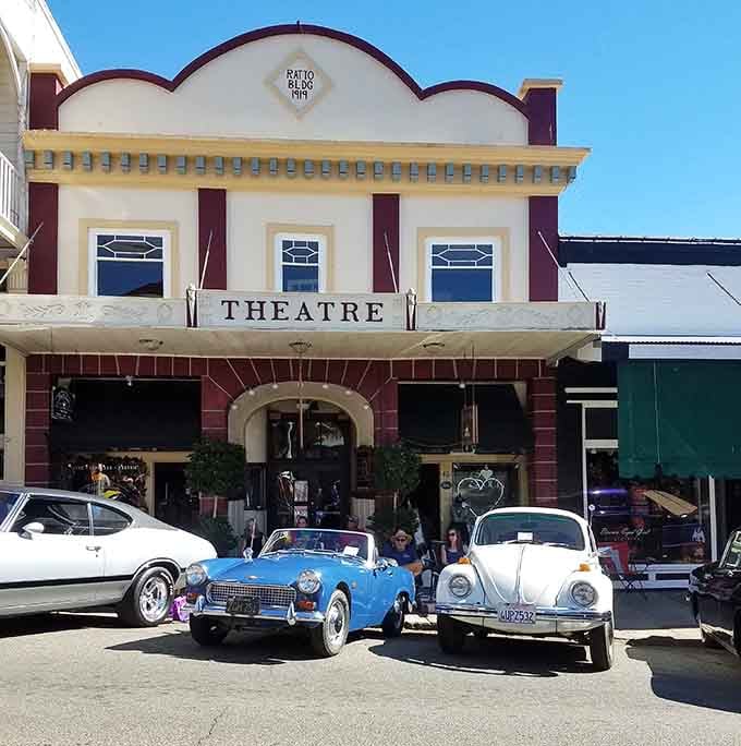The old theatre building now houses modern businesses, because even history needs to pay the rent somehow.