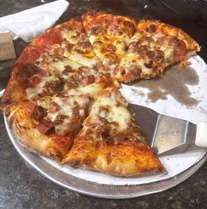 Loaded pizza with generous toppings shows the kitchen doesn't skimp on anything they serve here.