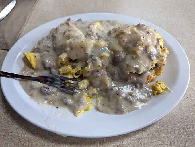 Biscuits drowning in sausage gravy is the kind of beautiful disaster that makes mornings worth waking up for, honestly.