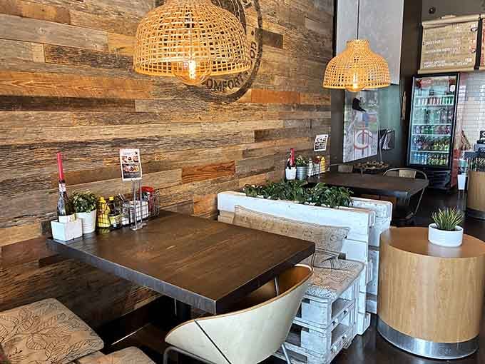 Reclaimed wood walls and mismatched seating create that effortlessly cool vibe without trying too hard.
