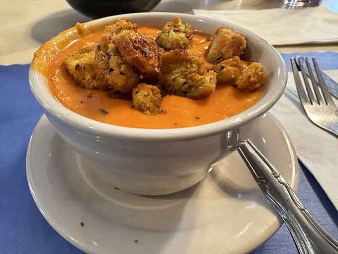 Creamy tomato bisque topped with golden croutons, because soup deserves to be this photogenic too.
