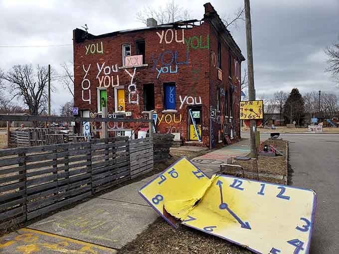 The word "you" repeats across brick walls, turning a simple pronoun into a powerful meditation on identity.