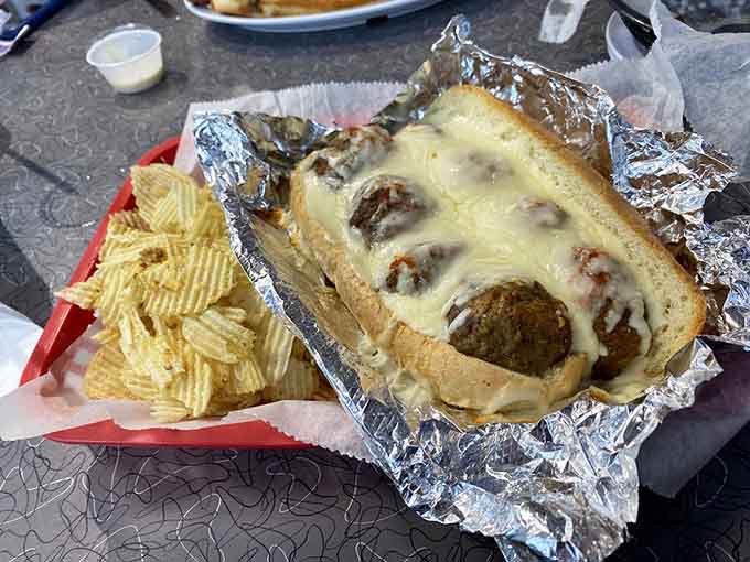 Tender meatballs swimming in sauce and blanketed with cheese create pure comfort in every bite.