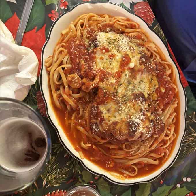 This spaghetti and chicken parm combo looks like Sunday dinner at your Italian grandmother's house, if she decorated with skulls.