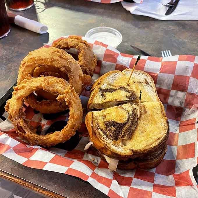 The patty melt on marble rye with those towering onion rings could make a grown person weep with joy.