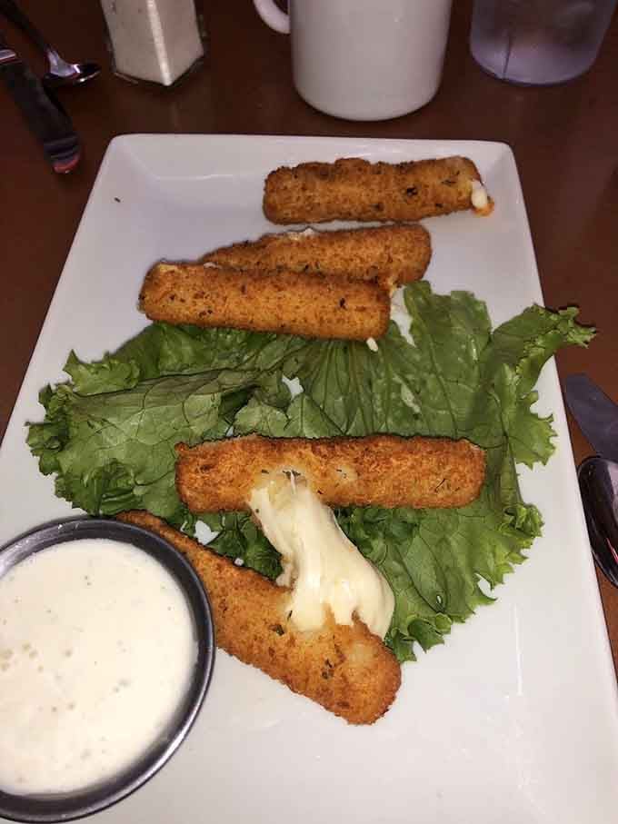Golden cheese sticks oozing melted goodness on crisp lettuce prove that stretchy cheese makes everything better.