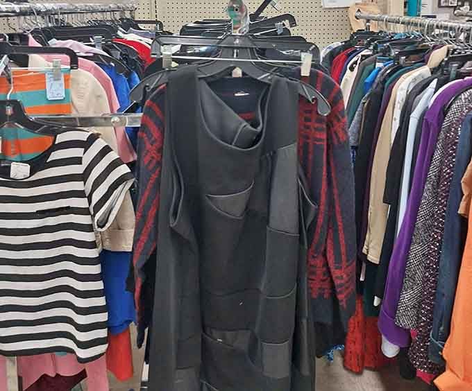 Women's clothing in every color imaginable hangs ready for its next adventure on someone else's shoulders.