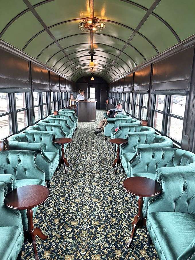 The Presidential Class Car's plush turquoise seating proves luxury and nostalgia can absolutely coexist in perfect harmony.