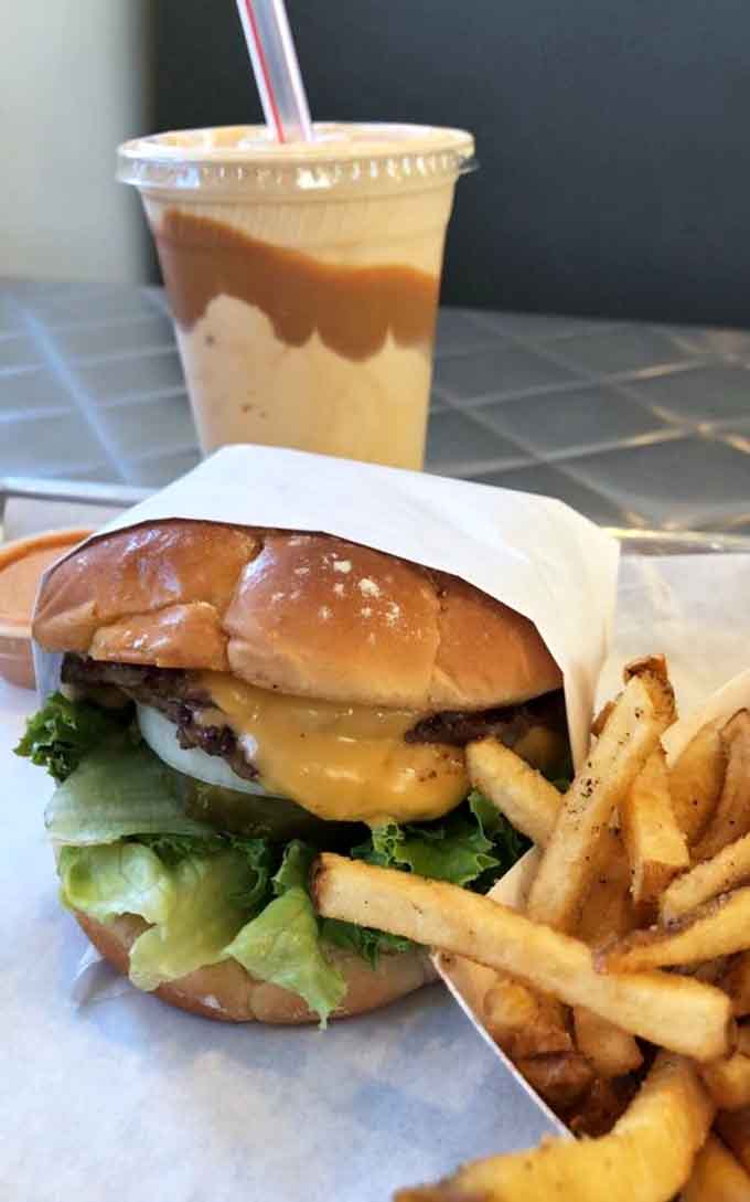 The holy trinity of burger joints: a perfectly grilled patty, golden fries, and a shake worth the brain freeze.