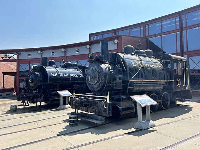 Historic locomotives on display remind visitors that this isn't just tourism, it's living history you can actually touch and photograph up close.