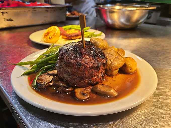 A filet mignon that sits atop mushrooms like a throne, reminding you why people still get dressed up for dinner.
