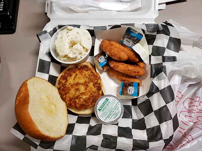 Golden fried fish with all the fixings, served on classic checkered paper like seafood shacks have done for generations.