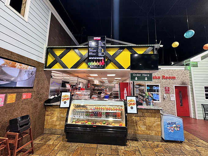 The snack bar fuels hungry drivers with refreshments, because navigating intersections builds surprisingly serious appetites in children.