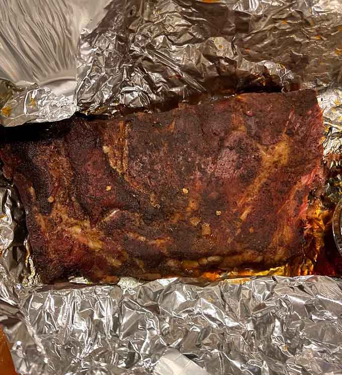 A full slab of ribs wrapped in foil is the kind of treasure map that leads to pure joy.