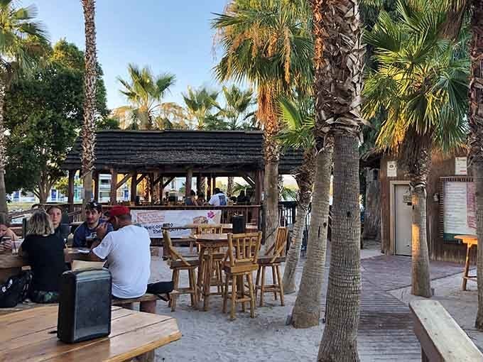 Palm trees and picnic tables create the perfect setting for serious lakeside relaxation and people-watching.