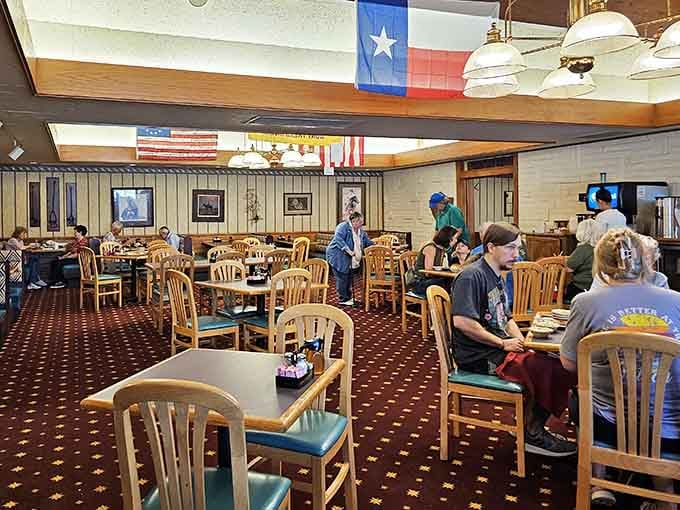 Texas and American flags hanging proud while folks enjoy their lunch in peace, exactly as it should be.