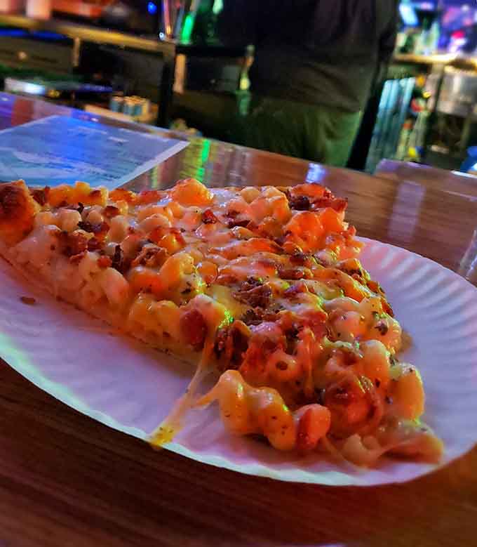 Mac and cheese on pizza is the kind of carb-on-carb action that makes perfect sense after a few rounds.