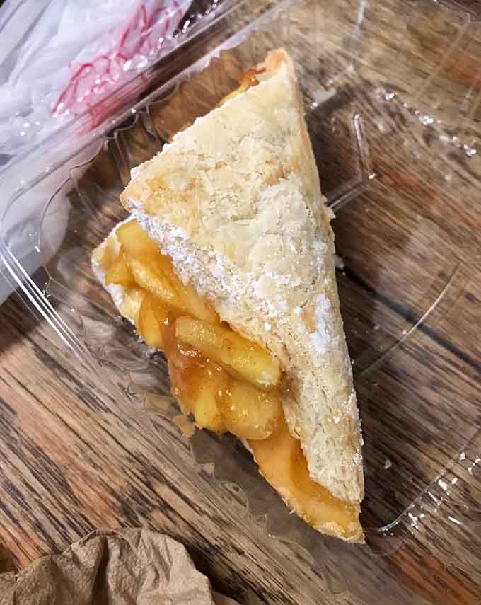 This apple turnover slice reveals layers of tender fruit wrapped in flaky pastry that practically melts away.