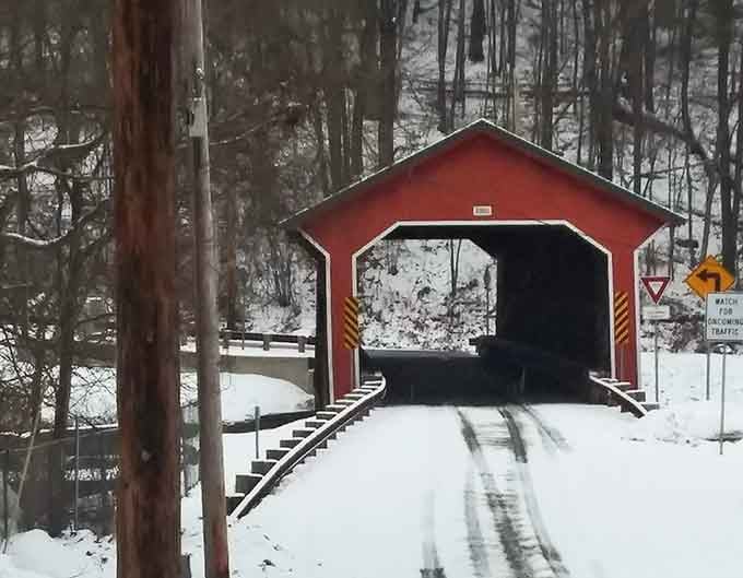 Snow transforms the bridge into a New England postcard that would make Currier and Ives jealous of their camera.