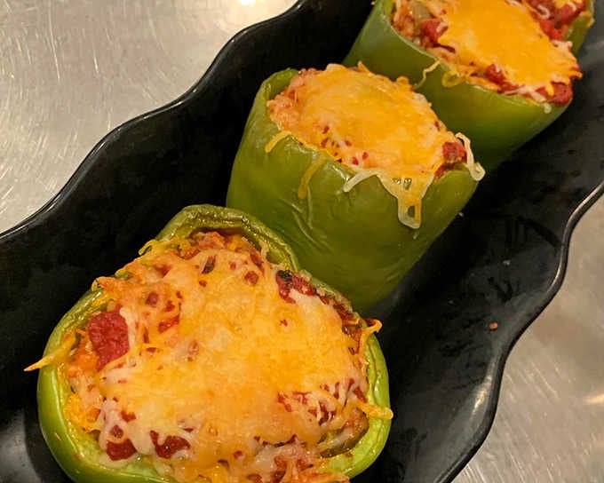 Stuffed peppers topped with melted cheese prove that comfort food doesn't always come between two slices of bread.