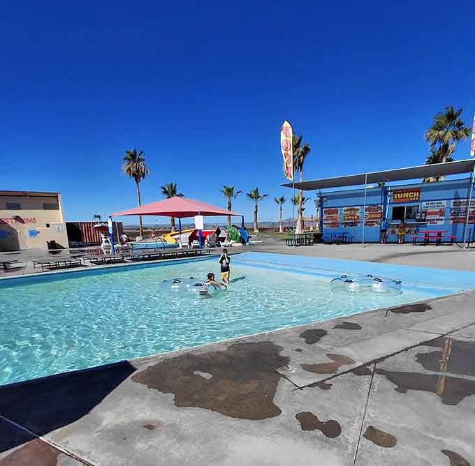 Shallow waters perfect for little ones, with palm trees swaying like they're keeping time to summer's soundtrack.
