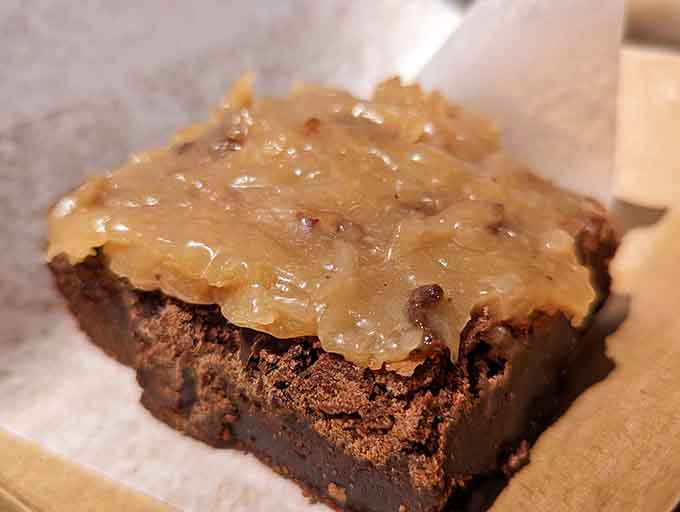 That chocolate brownie topped with what appears to be caramel-pecan goodness &ndash; because you earned dessert after all that meat.