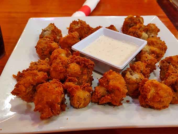 Crispy fried mushrooms that disappear faster than your resolve to save room for the main course ahead.