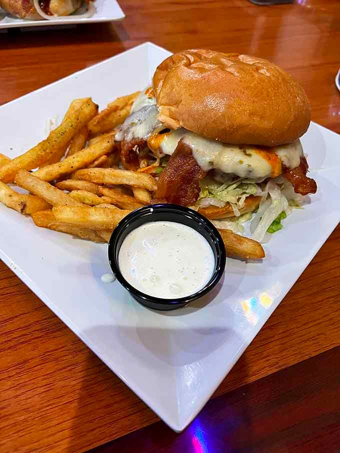 Bacon, cheese, and perfectly seasoned fries make this burger a triple threat worth every delicious calorie.