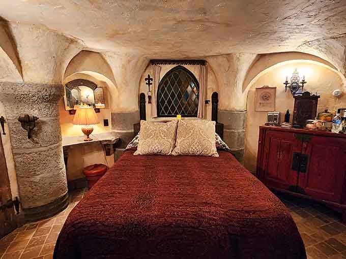 Vaulted stone ceilings and romantic lighting make this bedroom feel like where Sleeping Beauty would actually want to rest.