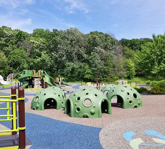 Those green dome structures invite climbing, crawling, and conquering, like miniature mountains designed for maximum adventure.
