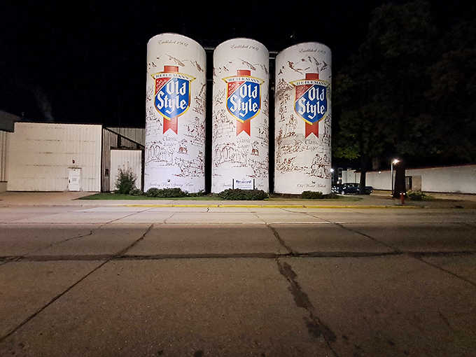 Under the streetlights, these giants take on an almost mystical quality, glowing beacons for beer enthusiasts everywhere.