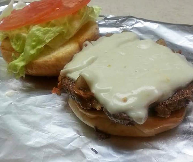 This burger wears its cheese like a blanket, melted and draped with the kind of care your grandmother showed.