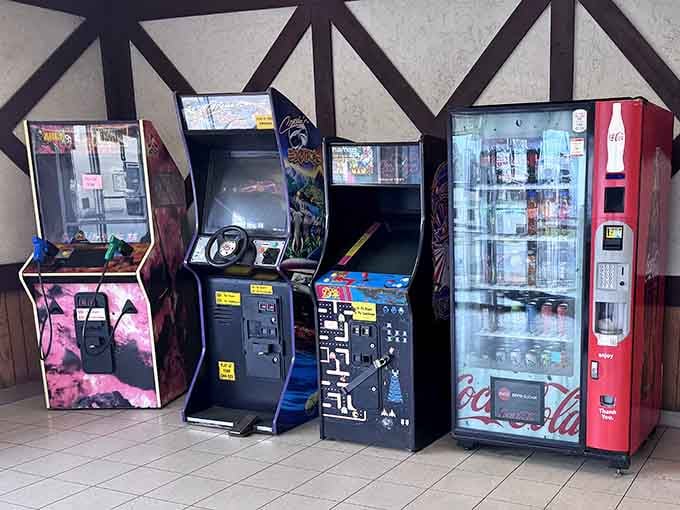 Classic arcade games providing entertainment while you wait, because nostalgia pairs surprisingly well with barbecue sauce.