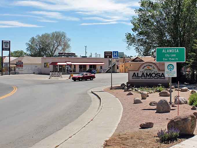 Welcome signs greet visitors at town limits where elevation matters more than pretension and neighbors still wave at strangers passing.
