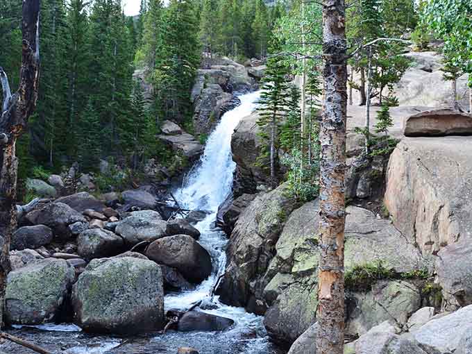 Massive boulders line the rushing stream, each one placed by nature's patient hand over countless years.