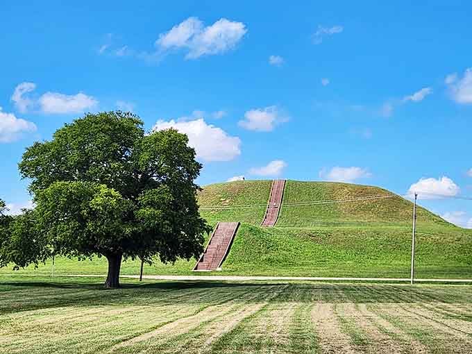 This massive earthen mound rises from the prairie, built by hand centuries before Columbus, proving ancient Americans were master engineers.