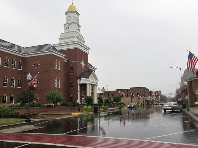 Rain-slicked streets reflect the courthouse clock tower in a scene that could sell a thousand retirement brochures.