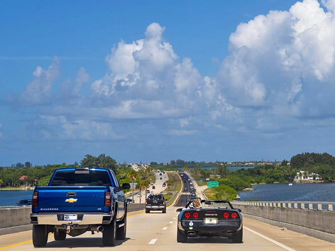 Classic cars and trucks cruise over the bridge while boats glide underneath &ndash; everyone's enjoying the good life.