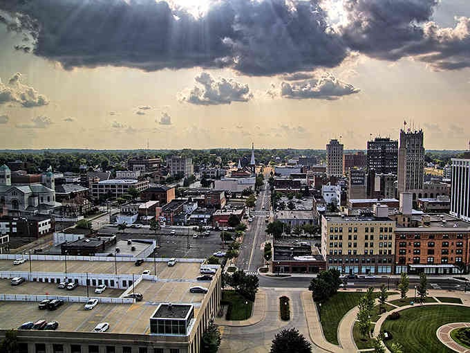 Dramatic clouds roll over the cityscape, creating a scene that's part Midwest charm, part Hollywood drama.