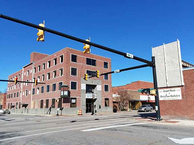 Downtown Laurinburg's brick buildings stand proud under Carolina blue skies, where affordable living meets authentic small-town charm.