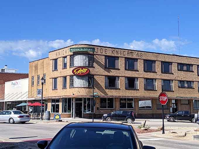 That classic brick facade tells stories of generations who've walked these streets, building dreams one day at a time.