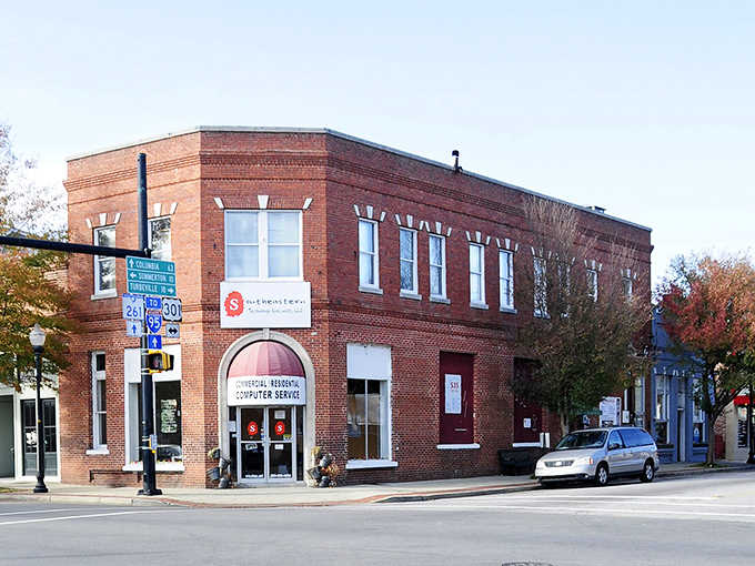 That solid brick corner building anchors downtown with classic architecture that refuses to go out of style.