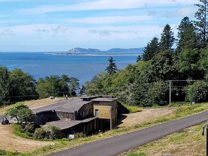 Rustic buildings perch above stunning coastal views, proving that simple living often comes with million-dollar scenery.