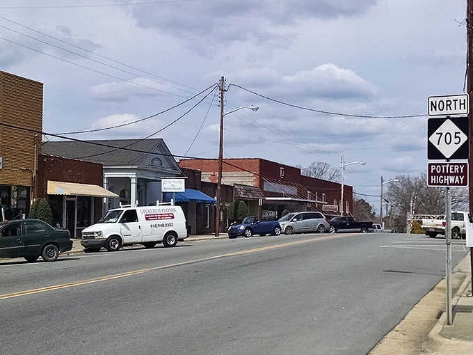 Main Street America lives on in small towns where the Pottery Highway sign points toward generations of handmade tradition.