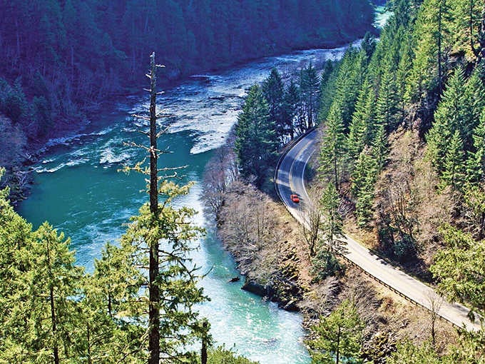 Turquoise water rushes alongside the highway, so clear and vibrant it looks like someone added food coloring upstream.